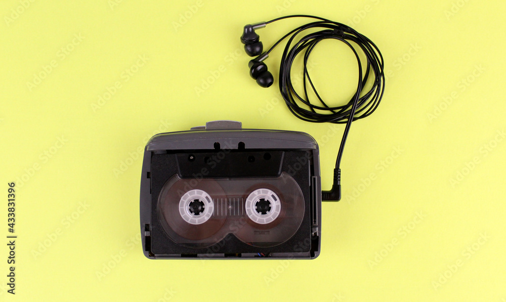 Old cassette recorder without front cover with cassette inserted ...