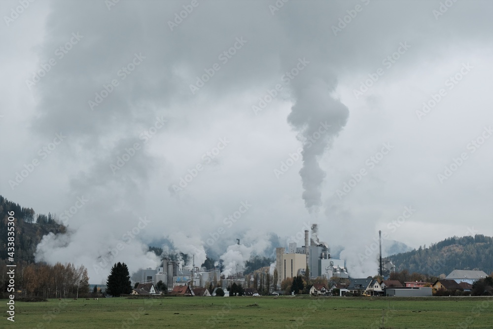 Ecological concept. City in clouds of technical smoke.Smoke from the ...