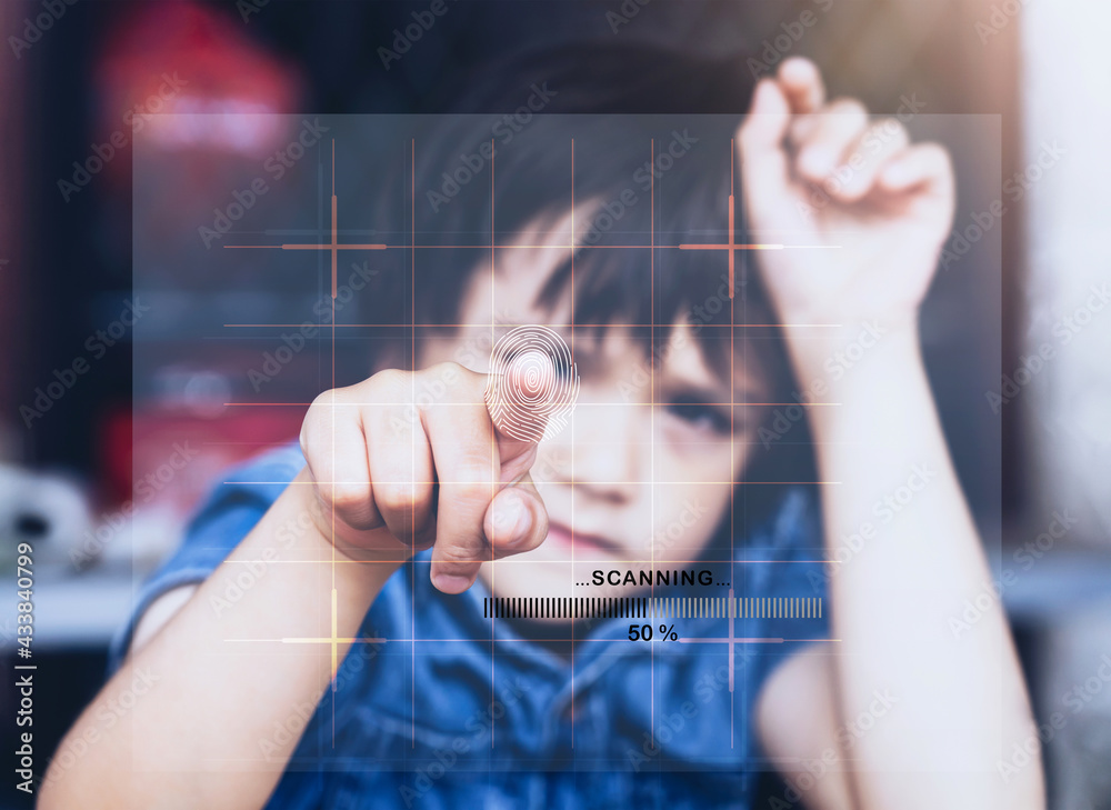 Young boy pointing fingerprint on digital screen, School kid pushing ...