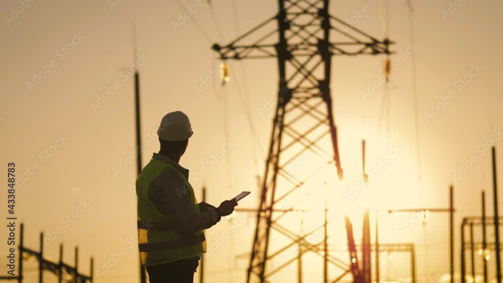 Electricity Work Concept. Silhouette Of Engineer In Helmet Standing On ...