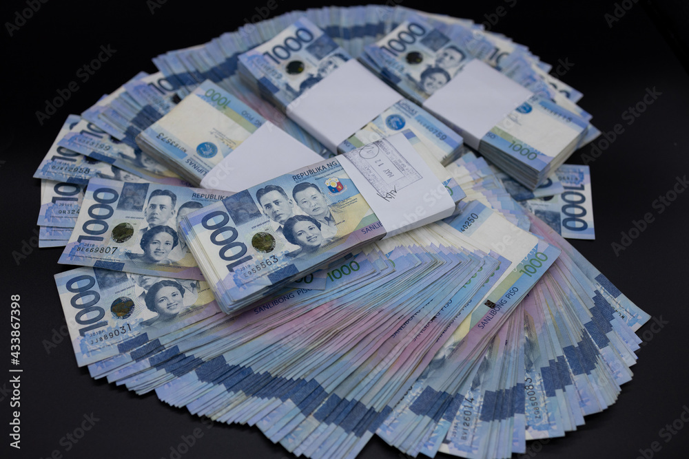 A pile of one thousand Philippines peso banknotes. Cash of Thousand ...