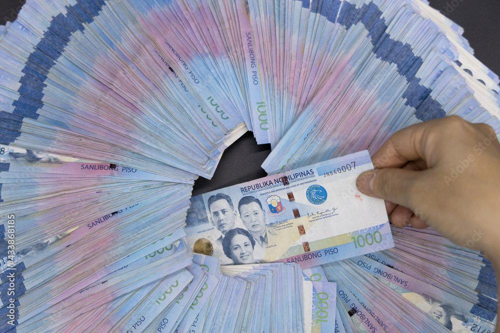 A pile of one thousand Philippines peso banknotes. Cash of Thousand ...