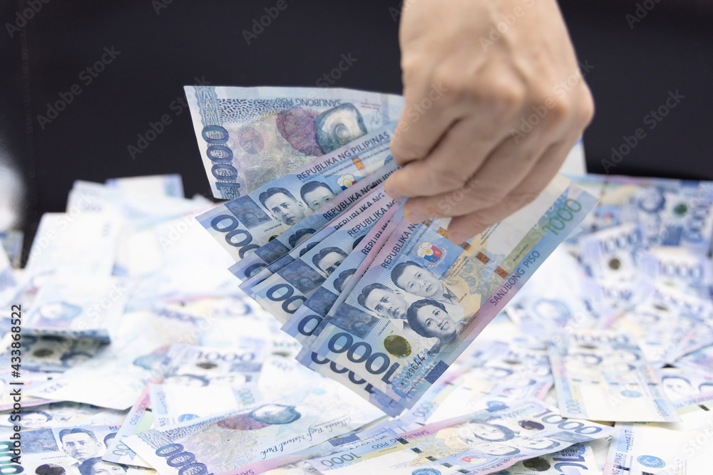 A pile of one thousand Philippines peso banknotes. Cash of Thousand ...