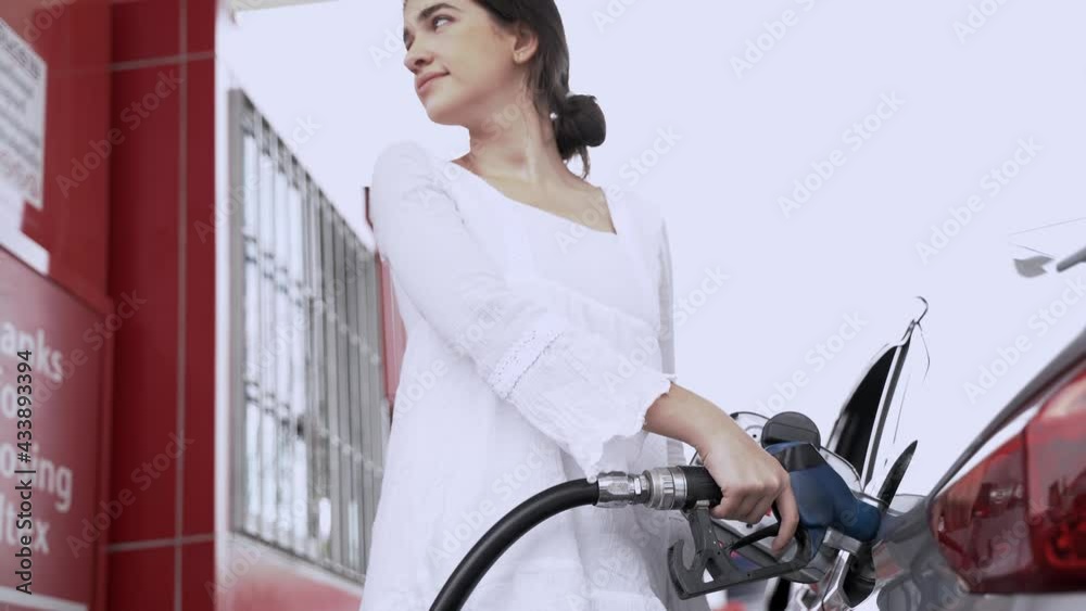 woman hand holding Petrol Pumping Fuel oil at gas pump. woman refuel ...