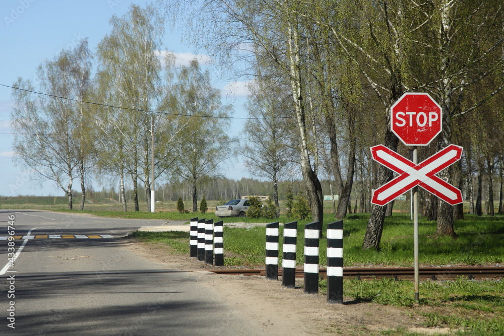 Road sign STOP on suburban non regulated empty one way railroad ...