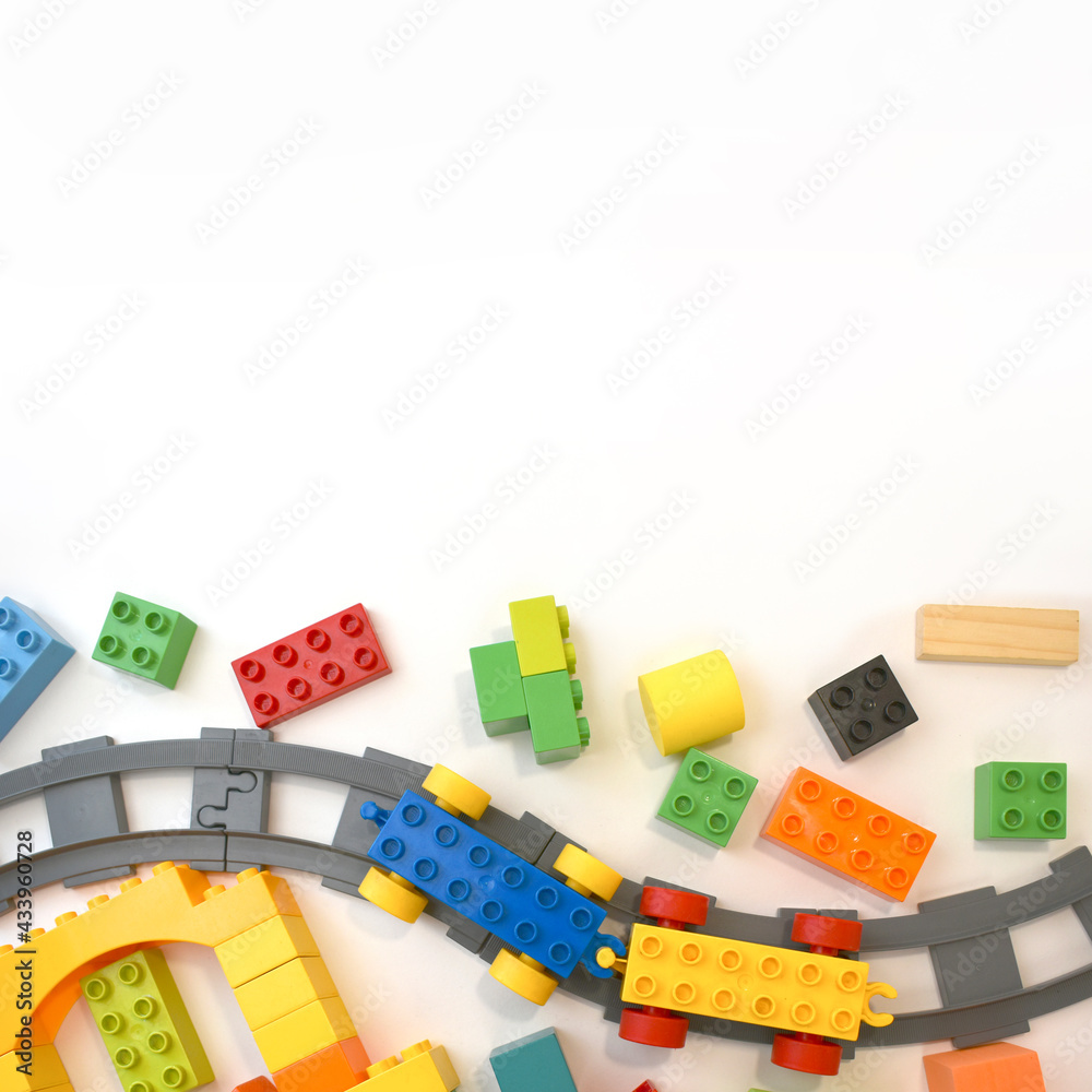 Colorful kids toys border with toy train, railway, plastic and wooden ...