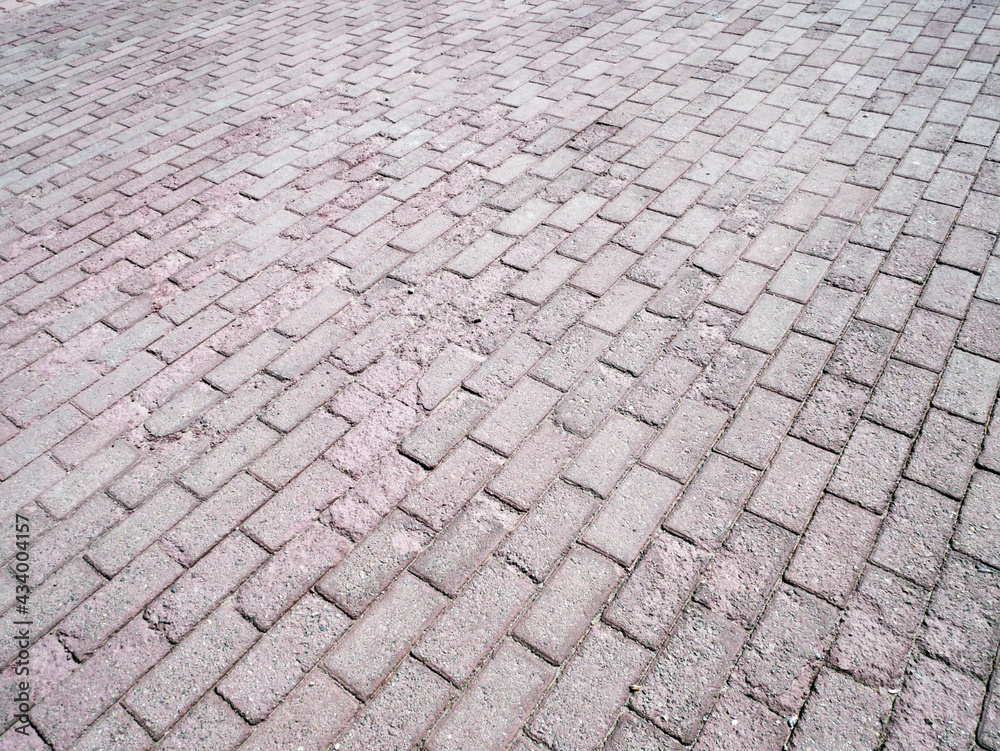 Worn out paving stone, pedestrian walkway, pavement close up in the ...