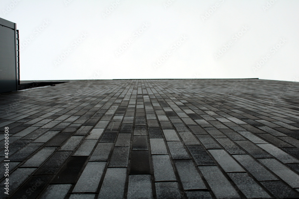 Grey textured wall of a modern building in chelmsford with a grey rainy ...
