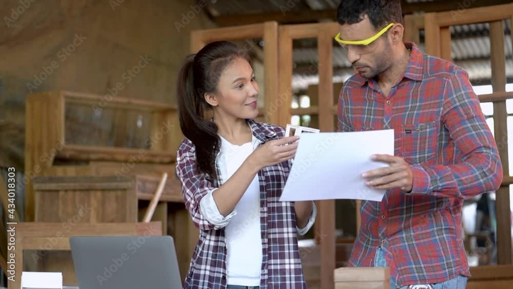 carpenter workers man and woman discussing to design the handcrafted ...