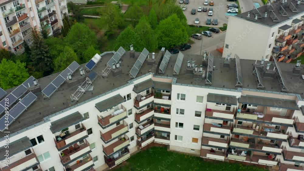 Aerial view of solar panels installed on the flat roofs of modern ...