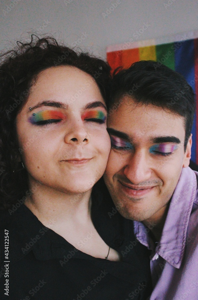 happy portrait of queer young man & woman smiling , friends of ...