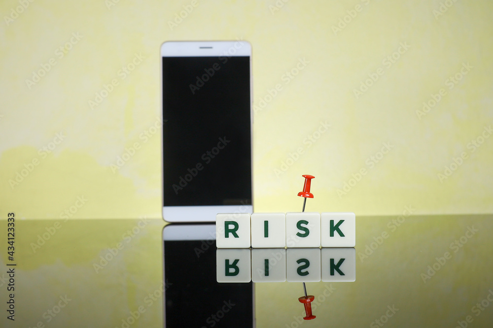 Risk and technology concept. Text on Risk written on the white cubes ...