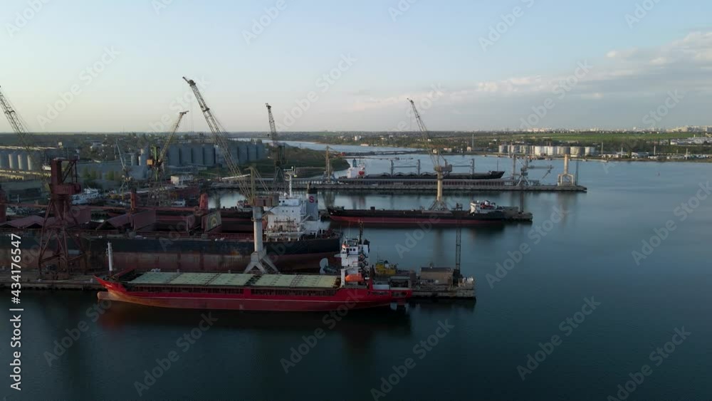 4K modern industrial port with containers from top or bird's eye view ...