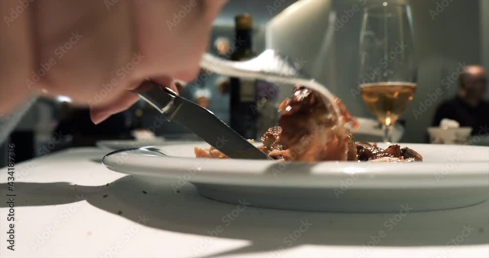 Close-up macro of Restaurant scene with male hand eating delicious ...