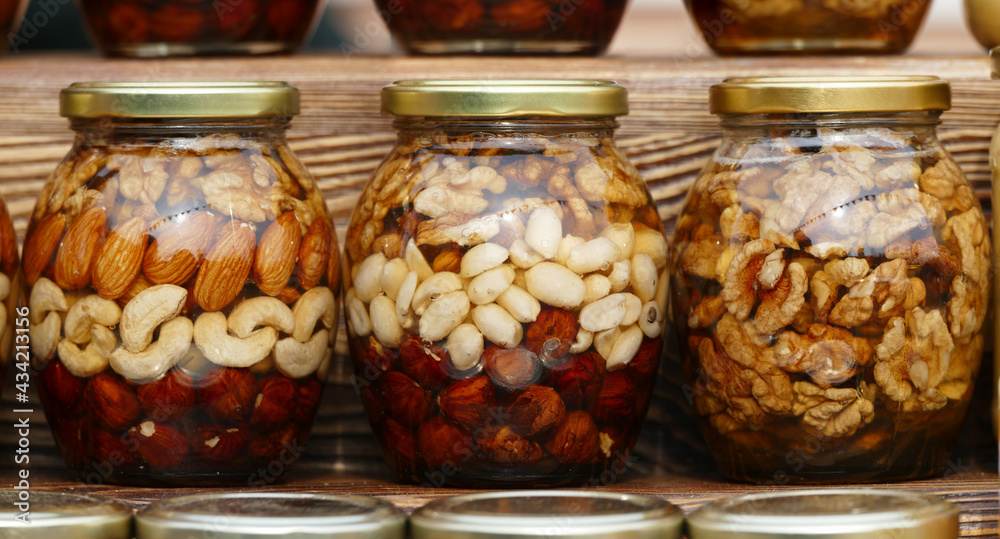 The walnut set is panoramic. Canned nuts in glass jars. Stock of ...