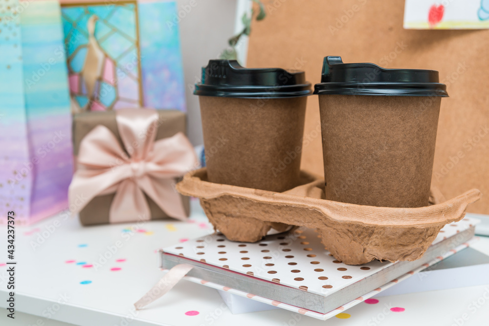 Two paper cups of takeaway coffee on the table. Place for your text or ...