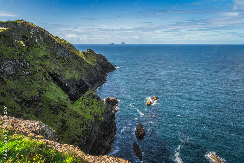 Tall Kerry Cliffs with a view on Great Skellig or Skellig Michael and ...
