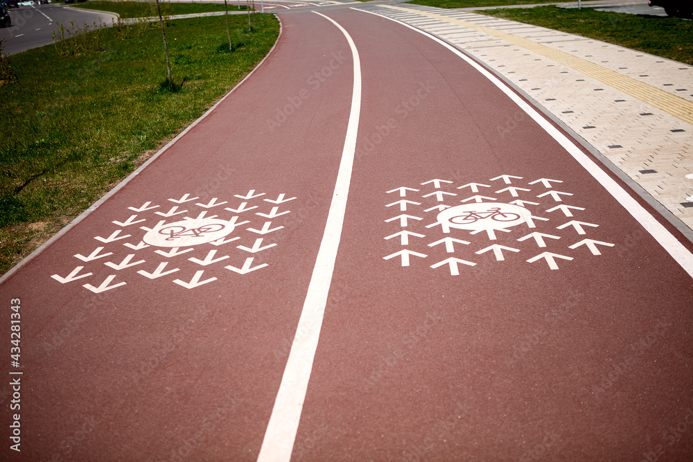 New modern cycle path with signs in the center of the summer city ...