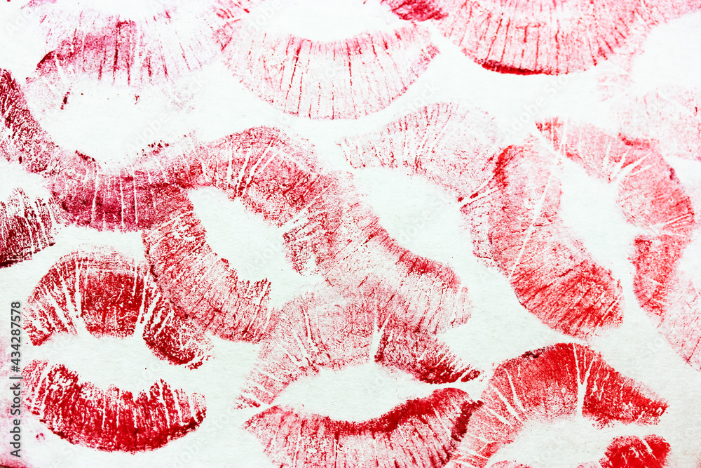 A lot of red kisses isolated on white background. Female lip prints on ...