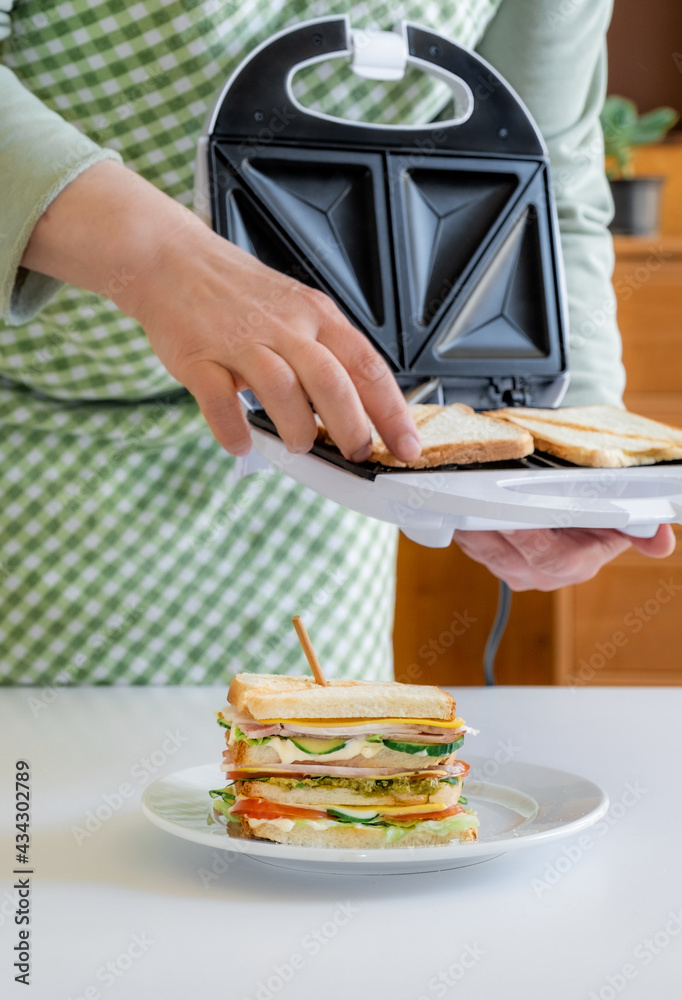 sandwich toaster toast bread slice hand fry hold biscuit cheese morning ...