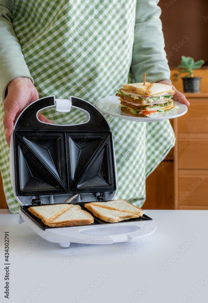 sandwich toaster toast bread slice hand fry hold biscuit cheese morning ...