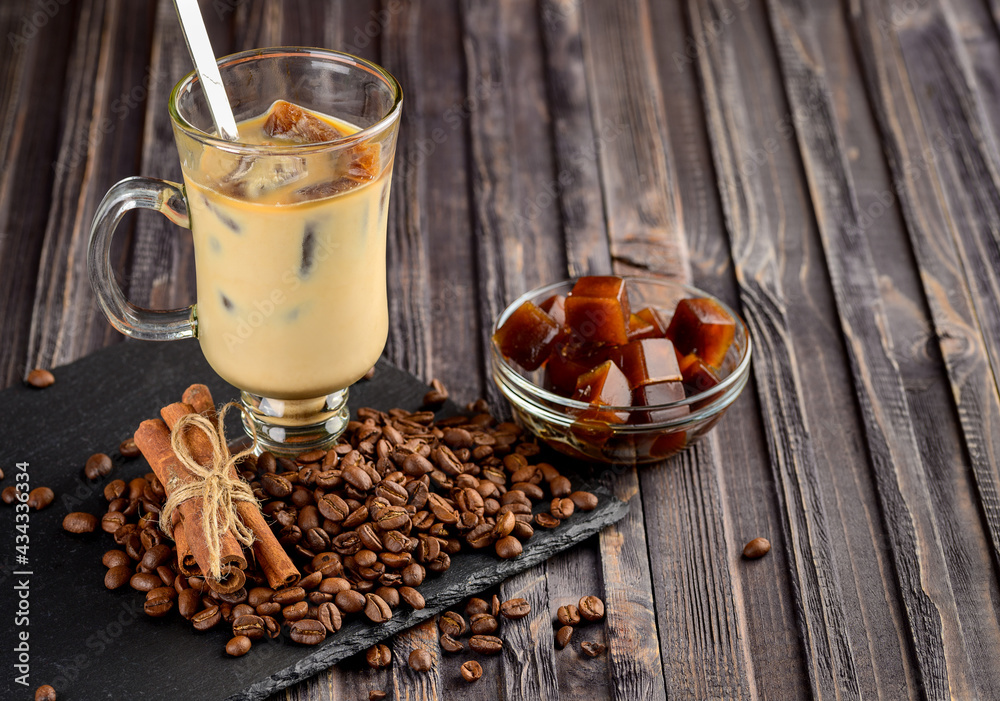 Cold drink: milk with frozen ice cubes . Iced coffee in a tall glass ...