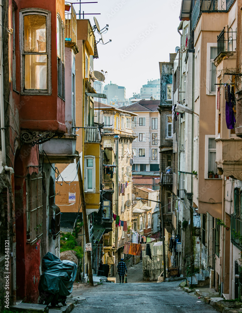 Vertical shot of the colorful buildings on an alley captured in ...