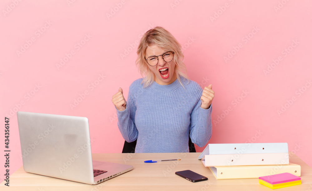 blonde pretty woman young pretty woman shouting aggressively with an ...