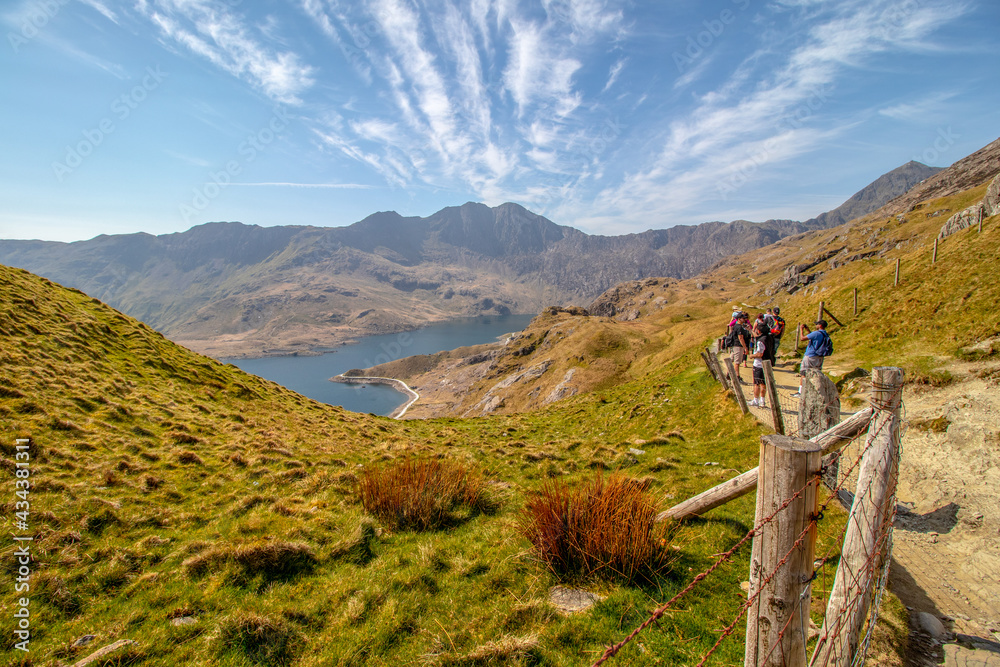 Snowdonia,Wales, UK. Tourist hiking at Snowdon mountain landscape ...