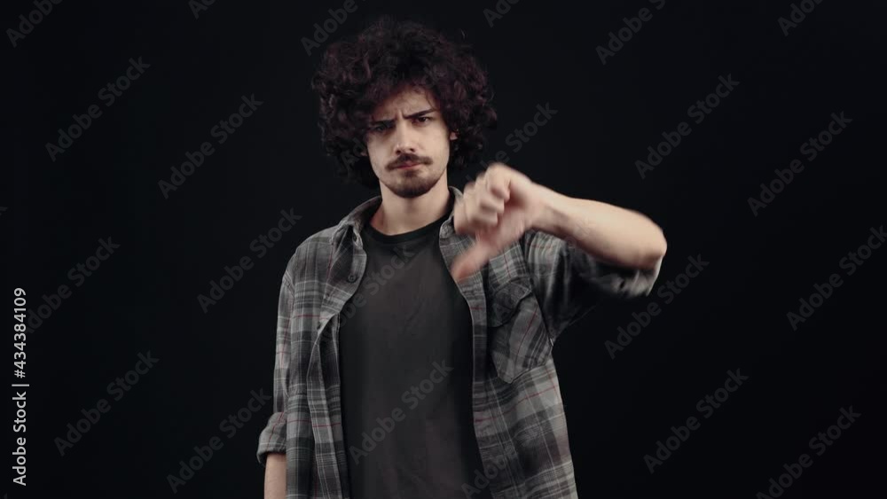 The disturbed young man says no and looks upset at the sign of dislike ...