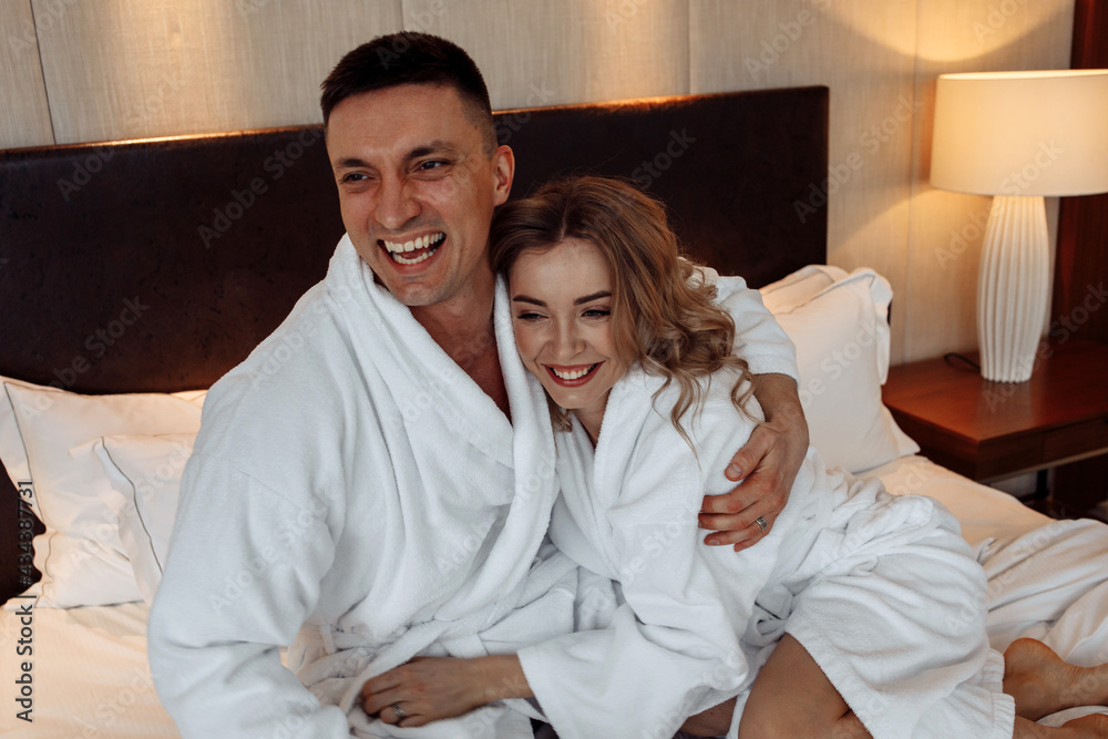 Husband and wife together in a hotel room. Photoshoot of a couple in ...