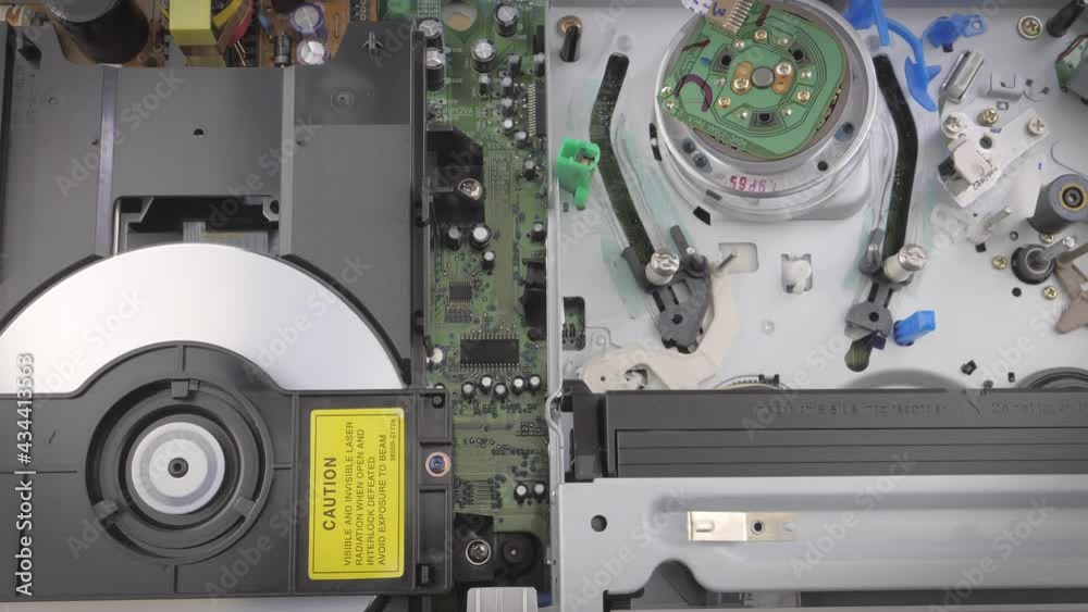Awesome shot of a vhs cassette and a dvd being inserted into a player ...