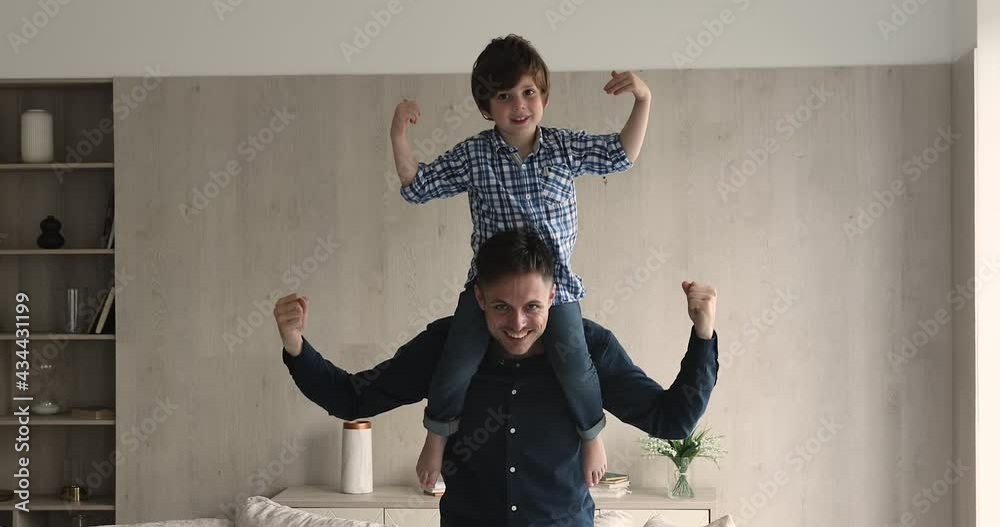 Cheerful strong man holding his little preschool cute 5s son on ...