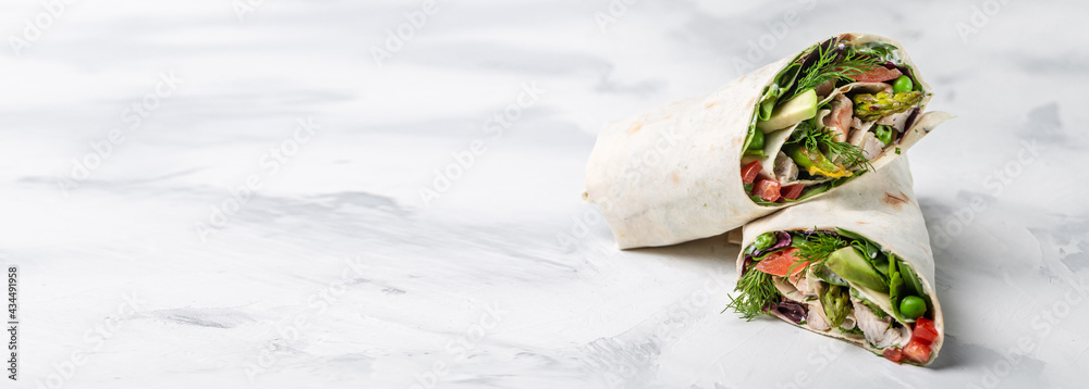 mexican tortilla wrap with chicken breast and vegetables Top view ...