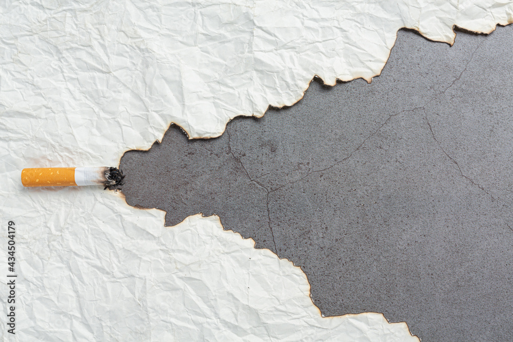 Cigarette burning the brown paper.Stop smoking and World no tobacco day ...