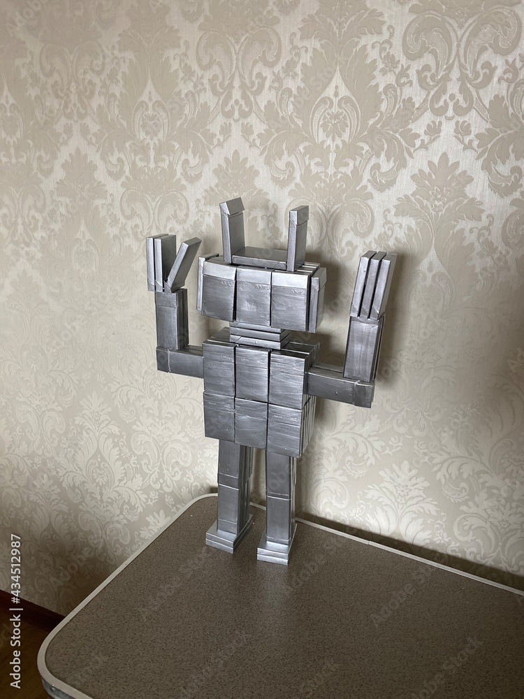 self made silver robot from a packs of cigarettes Stock Photo | Adobe Stock
