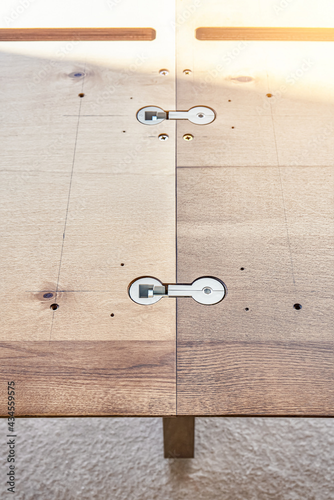 Assembling of large wooden dining table with installed worktop ...