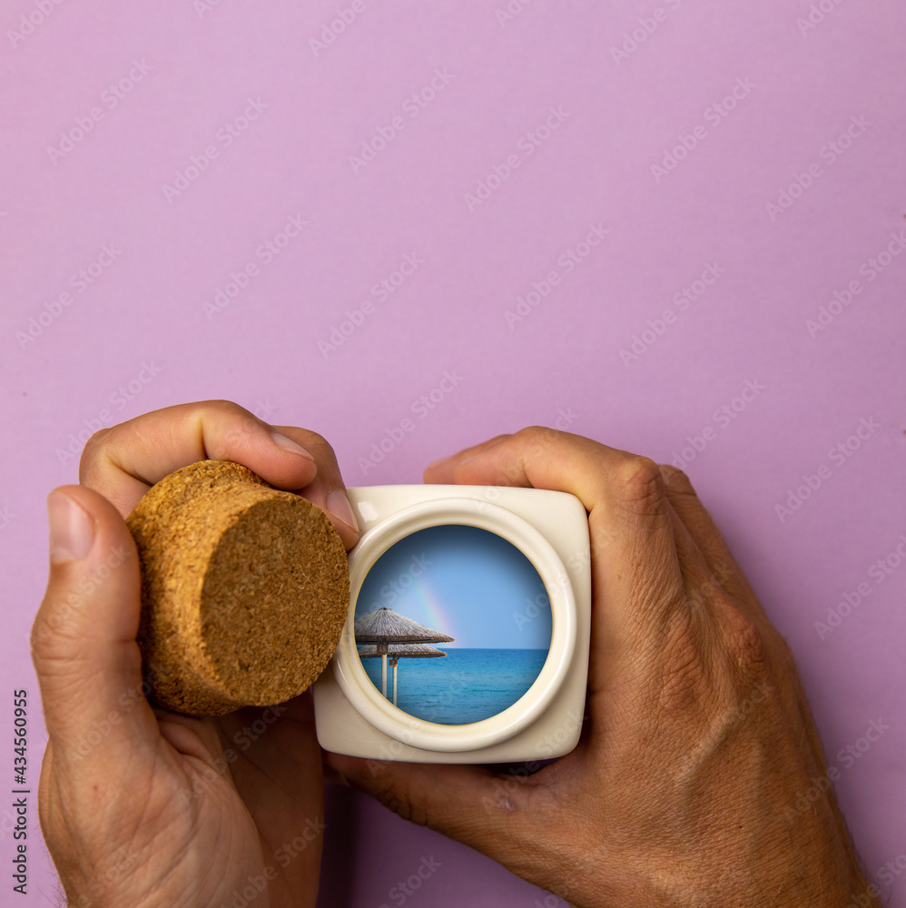 Top view of a bowl opened by a man's hand. Through the bowl you can see ...