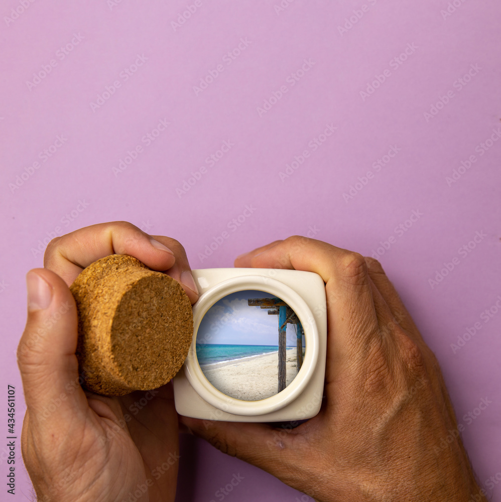 Top view of a bowl opened by a man's hand. Through the bowl you can see ...