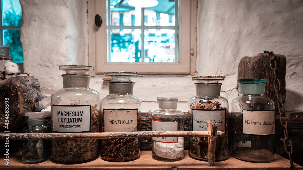 Old vintage chemical laboratory with glass bottles and dry ingredients ...