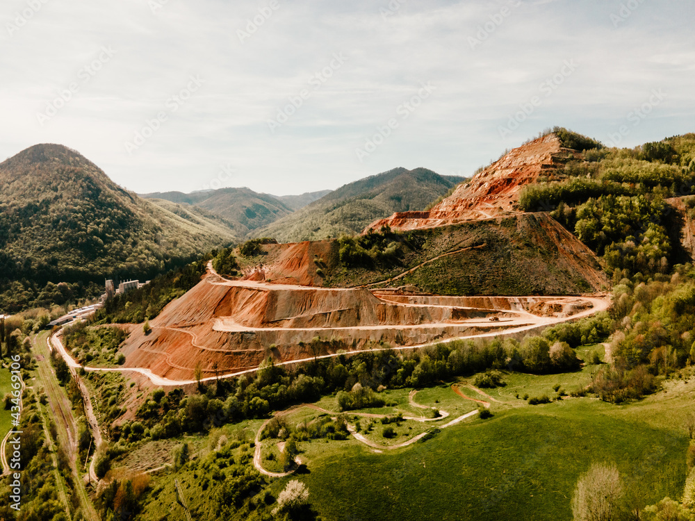 Open pit mine, aerial view. Bottom of surface mining and machinery in ...