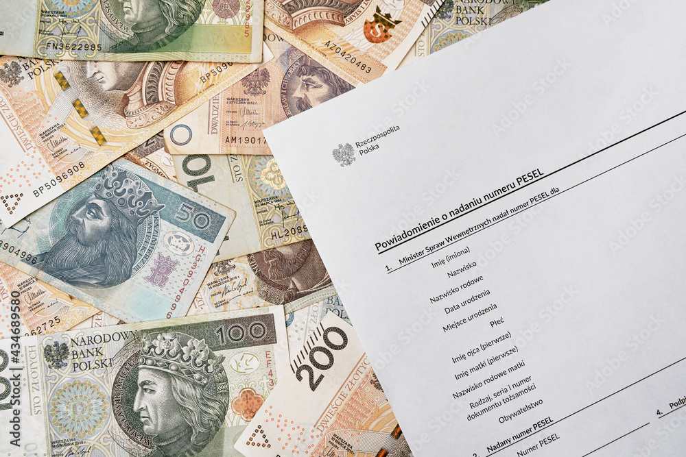 National identification number document in background of zloty and ...