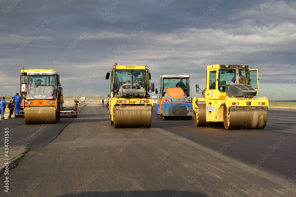 Road rollers leveling fresh asphalt pavement Stock Photo | Adobe Stock
