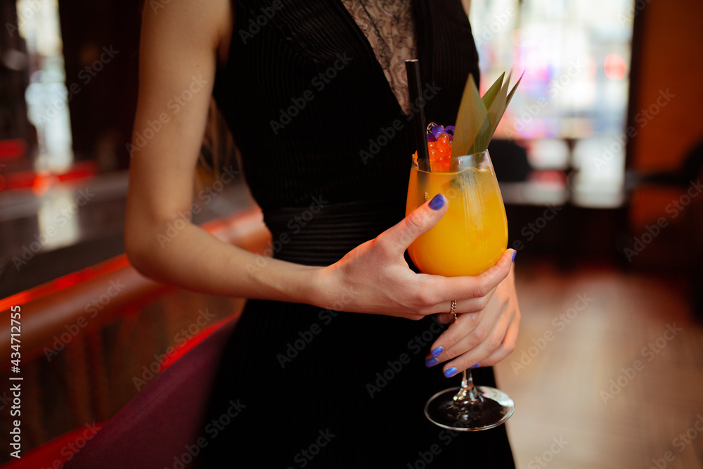 moody portraits of gorgeous blond girl with cocktail in fashion black ...