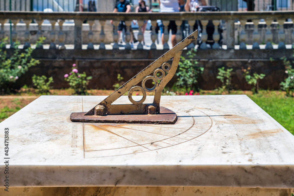Old sundial at the National Garden public park, at the center of Athens ...