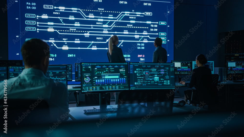 Project Manager and Computer Science Engineer Talking while Using Big ...