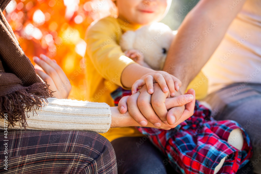 Concept of unity, support, protection, happiness. Child hand closeup ...
