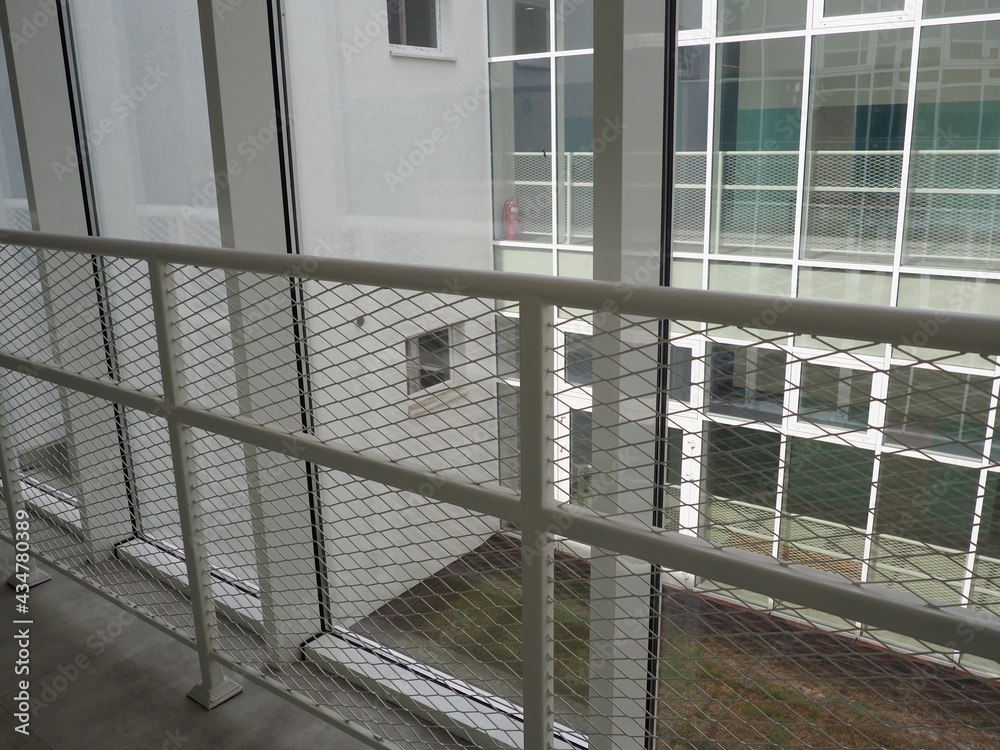 New white frames and windows. Metal fence for the safety of ...