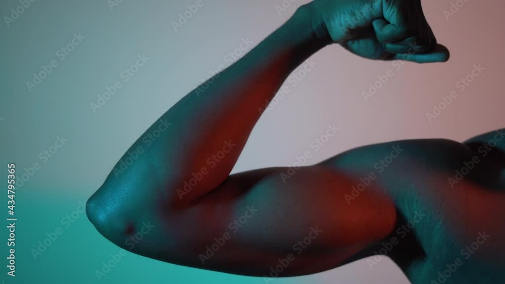 Muscular black male flexing his bicep muscle. Strong black male showing ...