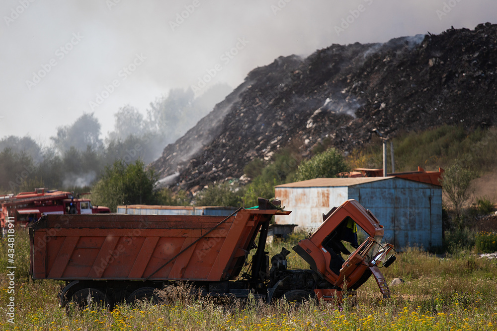 a fire at a landfill. a cloud of toxic waste from burning plastic ...
